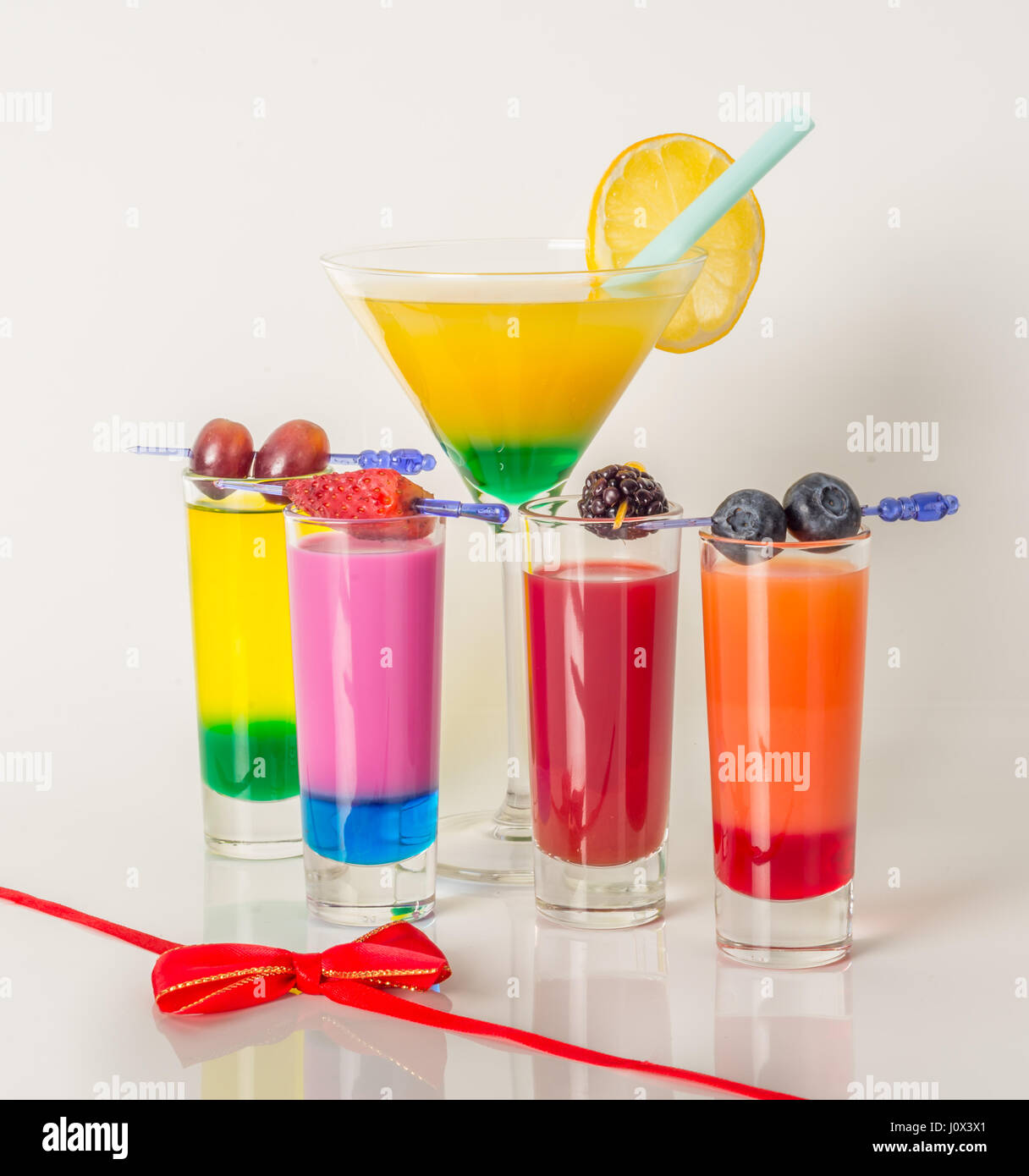 Colorful set of drinks, color drink decorated with fruit, color shots ...