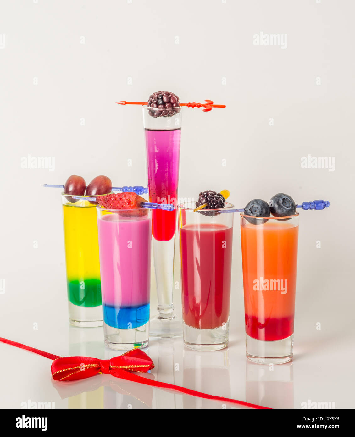 Colorful set of drinks, color drink decorated with fruit, color shots ...