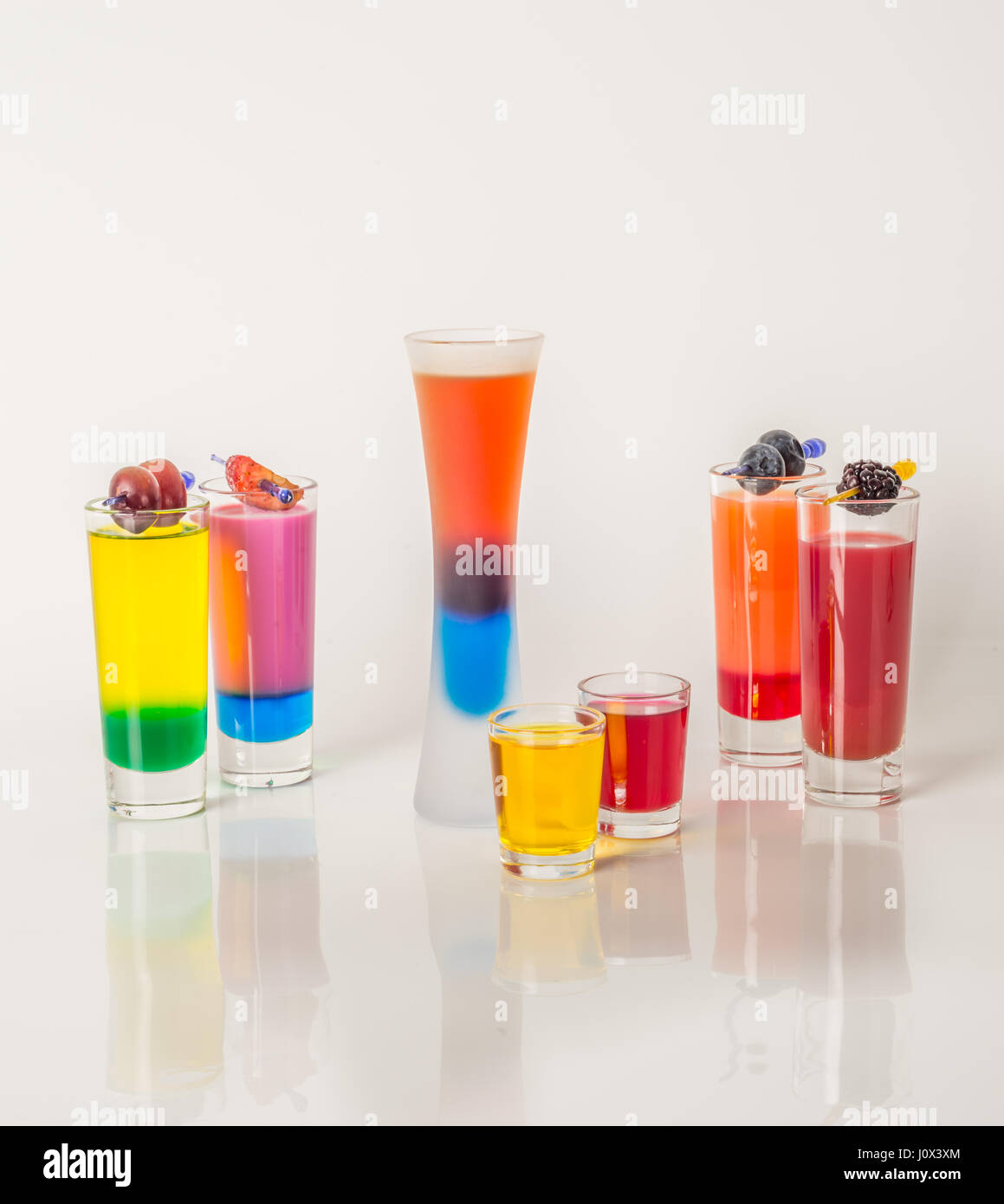 Colorful set of drinks, color drink decorated with fruit, color shots ...