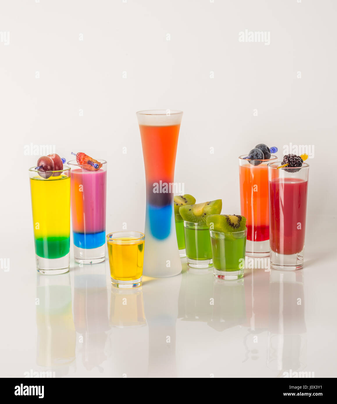 Colorful set of drinks, color drink decorated with fruit, color shots ...