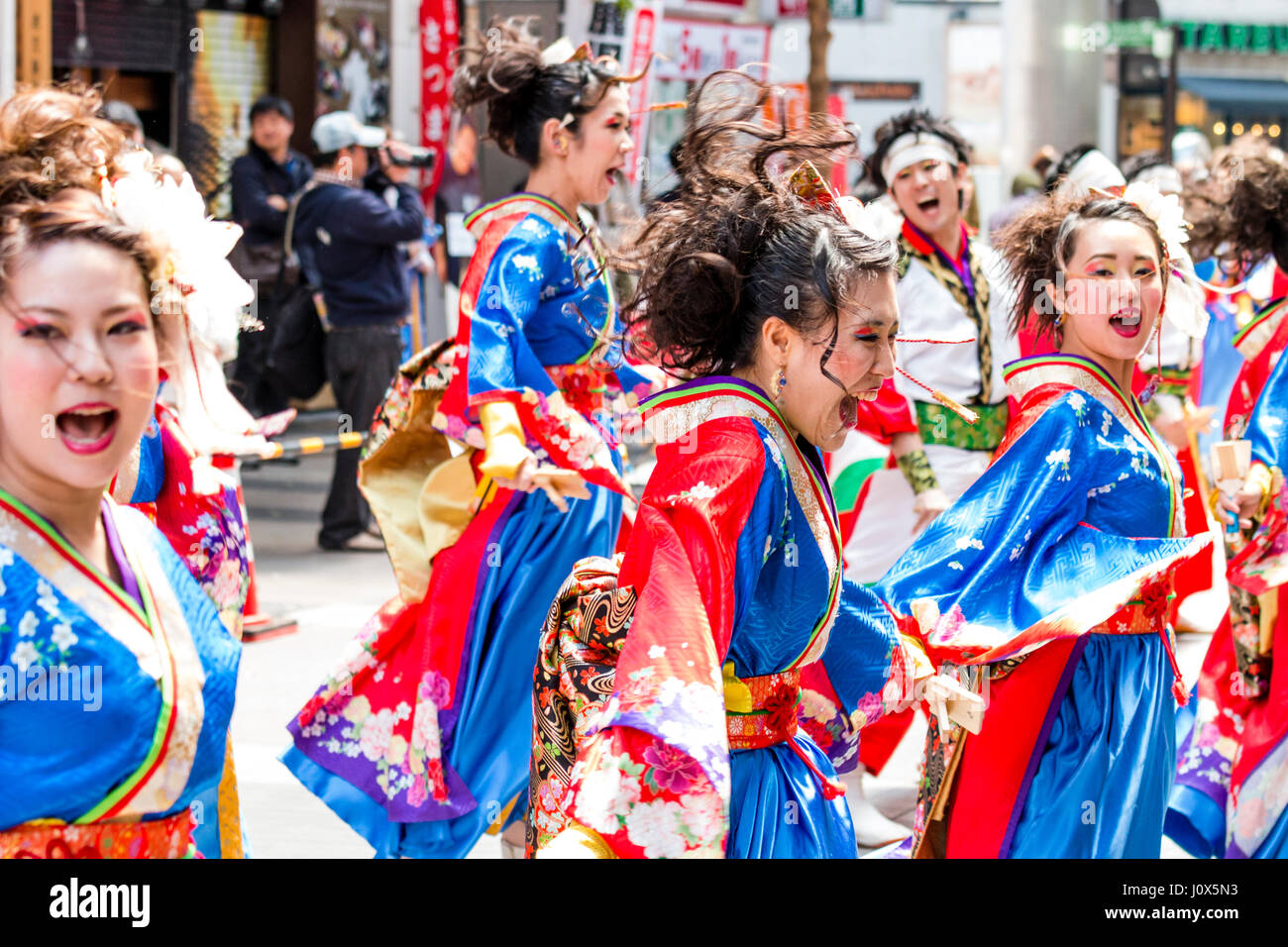 Hinokuni Yosakoi Dance Festival. Women team in blue and red yukata ...