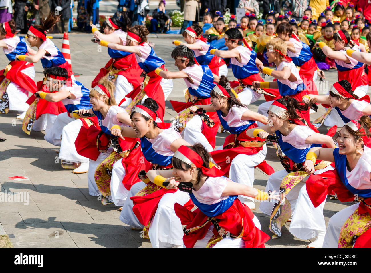 Kumamoto, Hinokuni Yosakoi Dance festival. Dance team in red, blue and ...