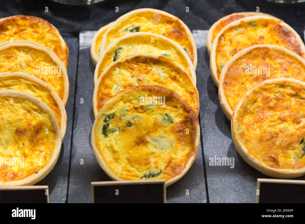 quiche on the counter with a price tag Stock Photo - Alamy