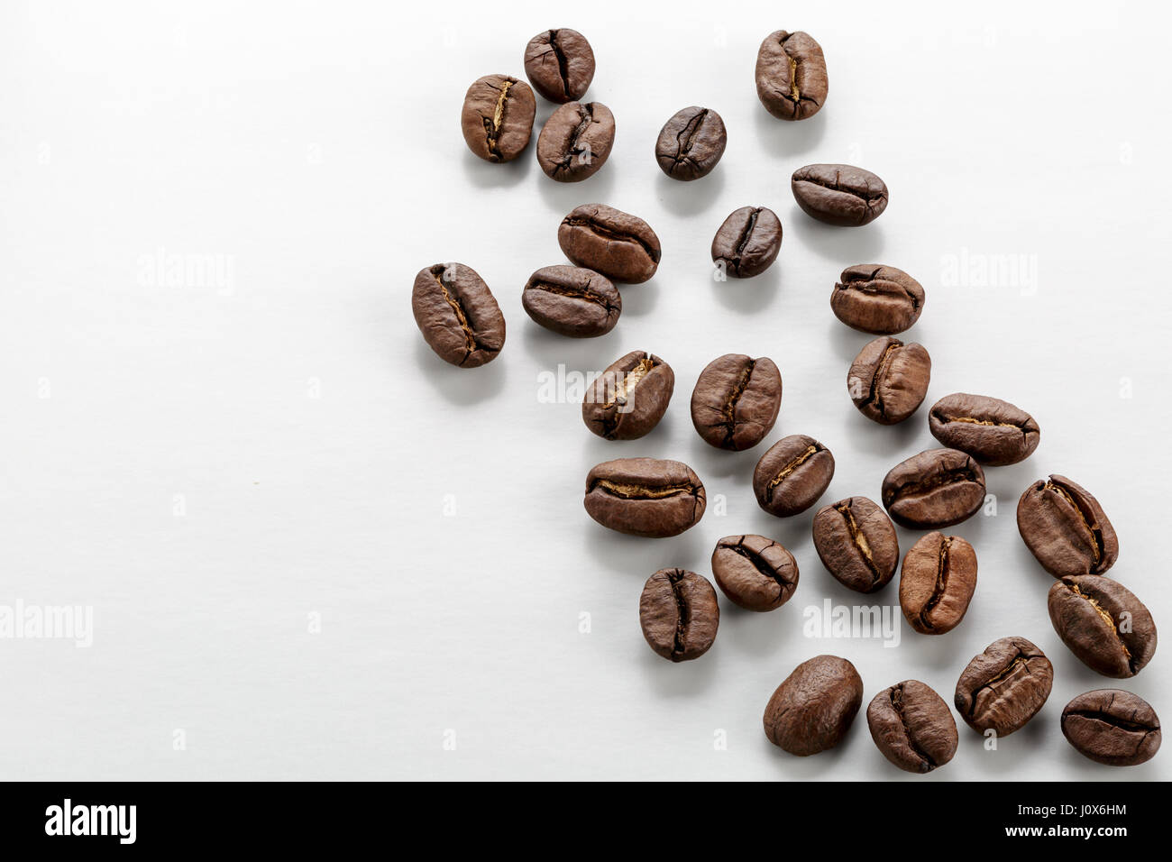 Scattered coffee beans Stock Photo - Alamy