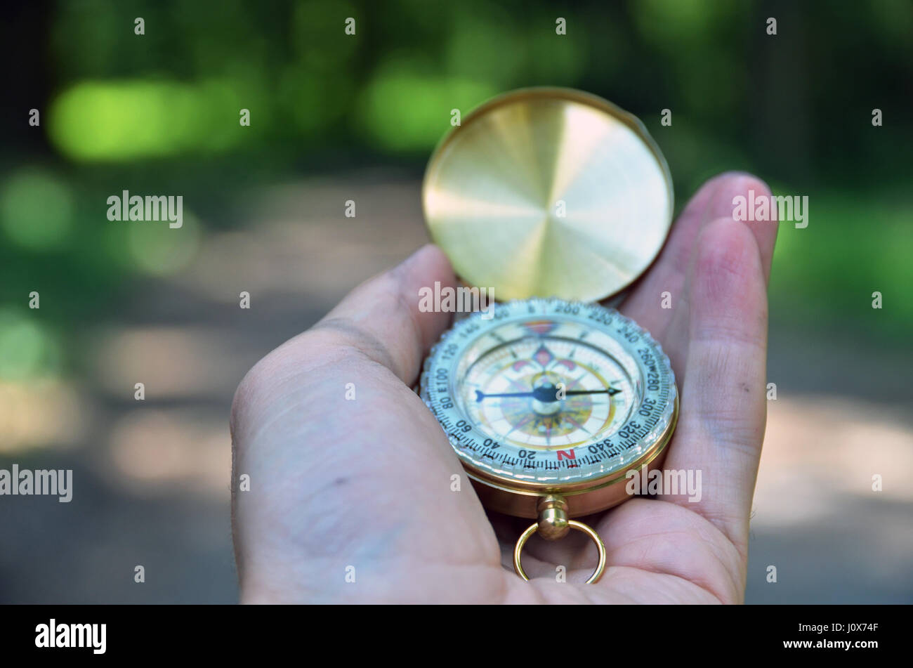Compass in the hand Stock Photo - Alamy