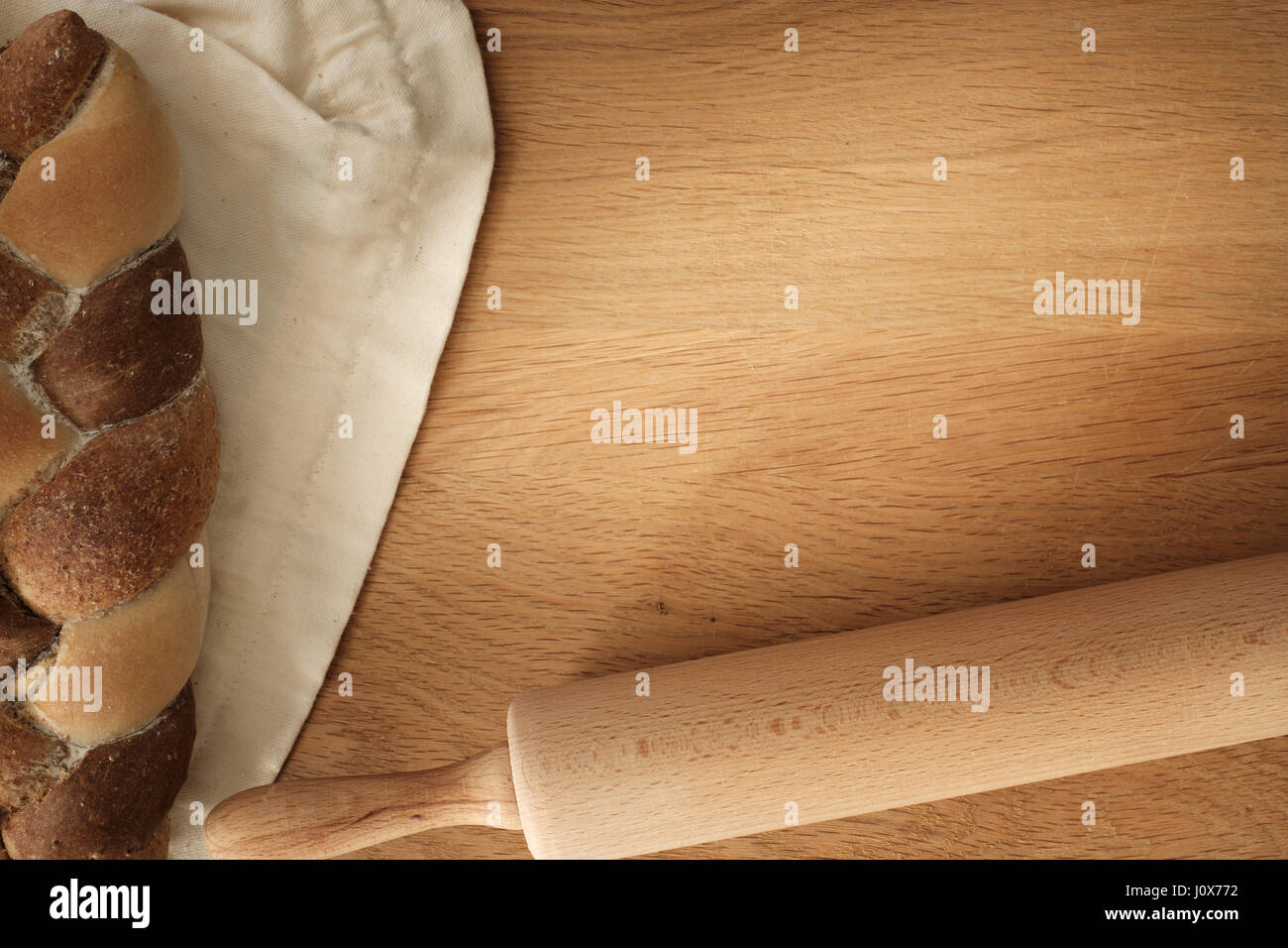 bread with rolling pin on a wooden table with copy space, food concept ...