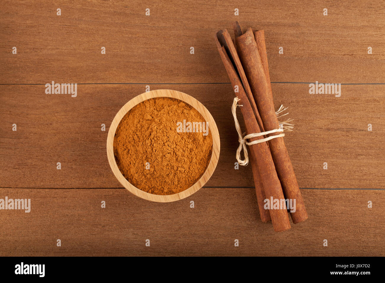 top view cinnamon stick and cinnamon powder on wood background Stock ...