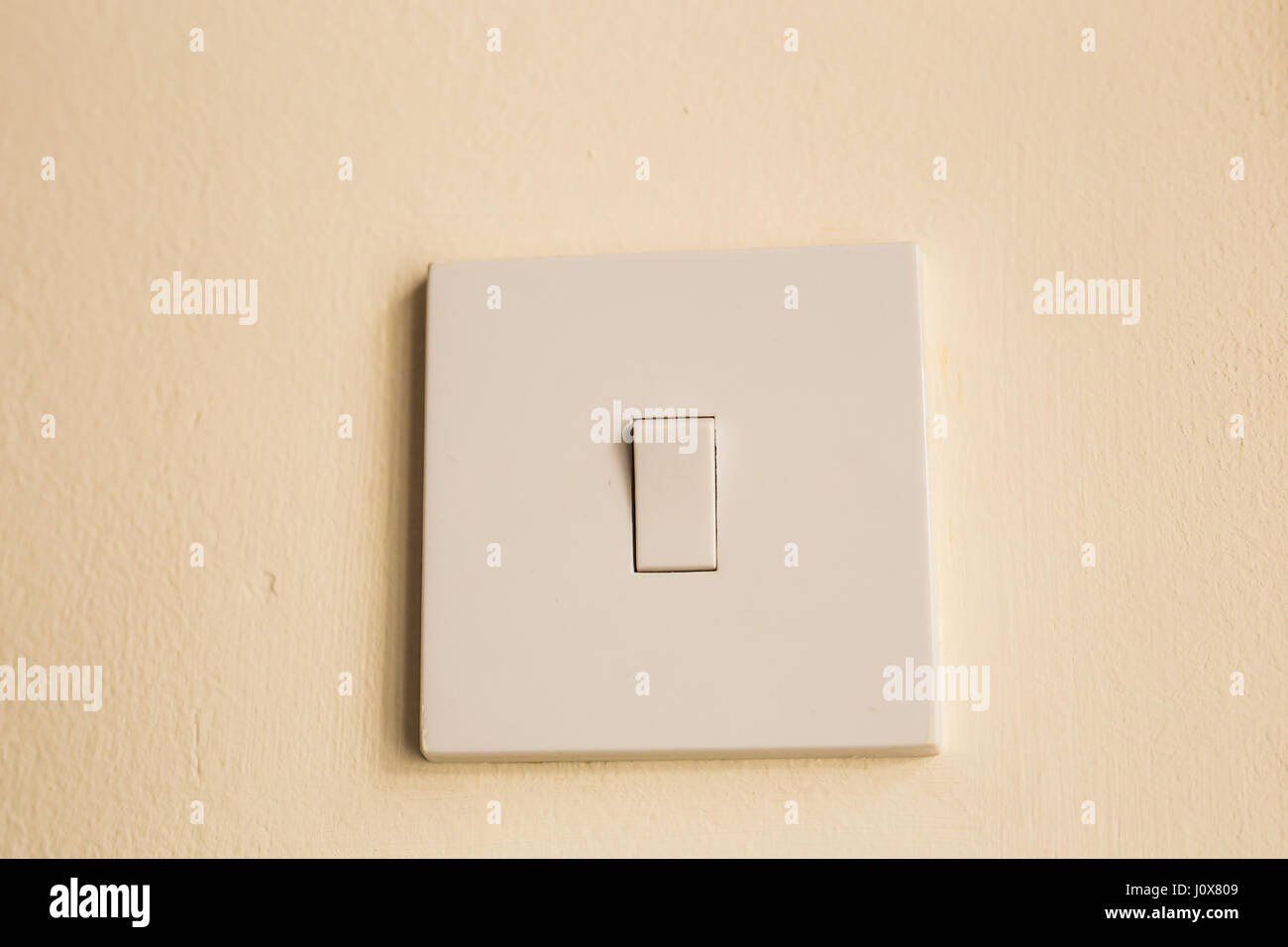 White light switch, turn on or turn off the lights Stock Photo - Alamy
