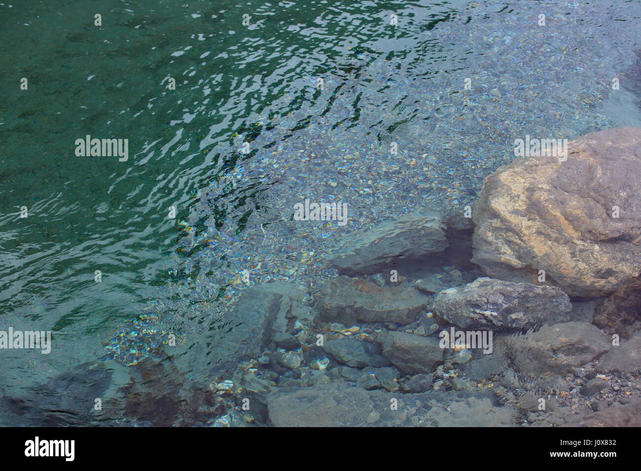 Close-up view on pebble stones in pure transparent water Stock Photo ...