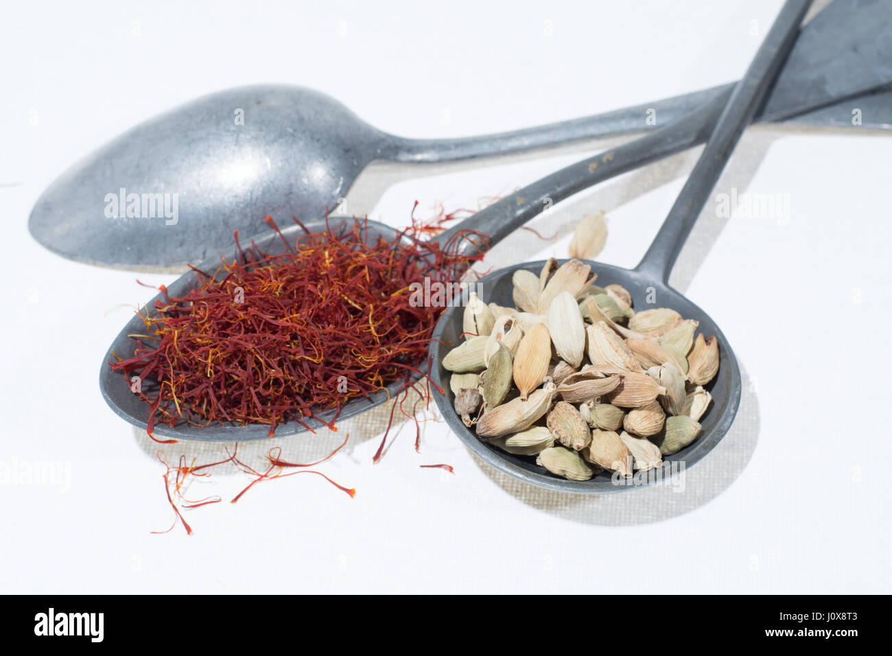 Raw Organic Red Saffron and Cardamom Spices Stock Photo - Alamy