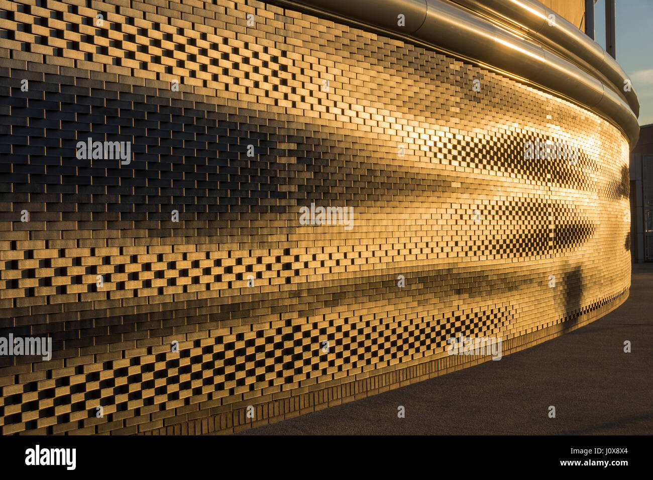 Sunlight forming patterns on the angled brickwork of the Manchester ...