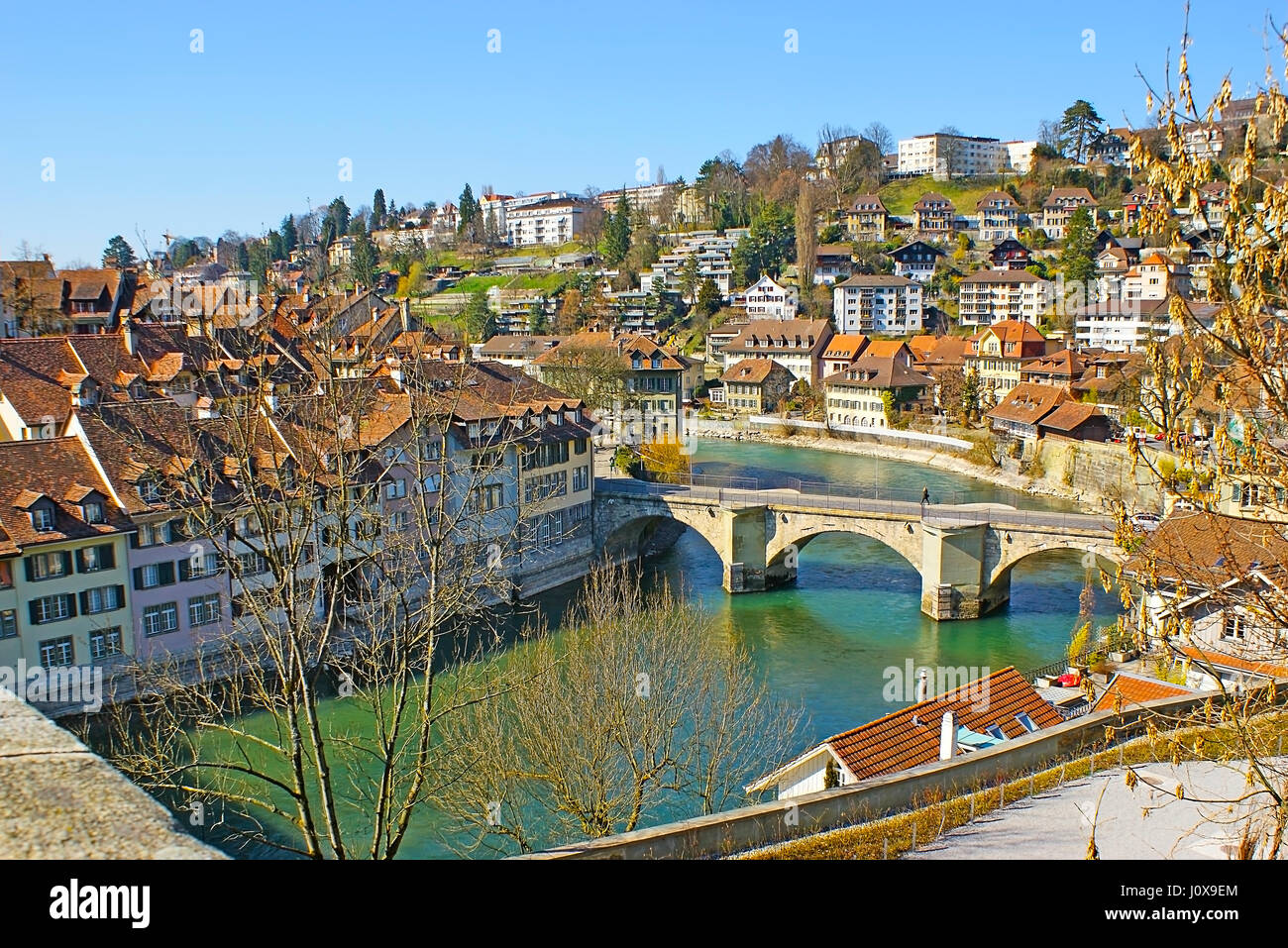 The stone arched Untertor bridge connects two banks of Aare river ...