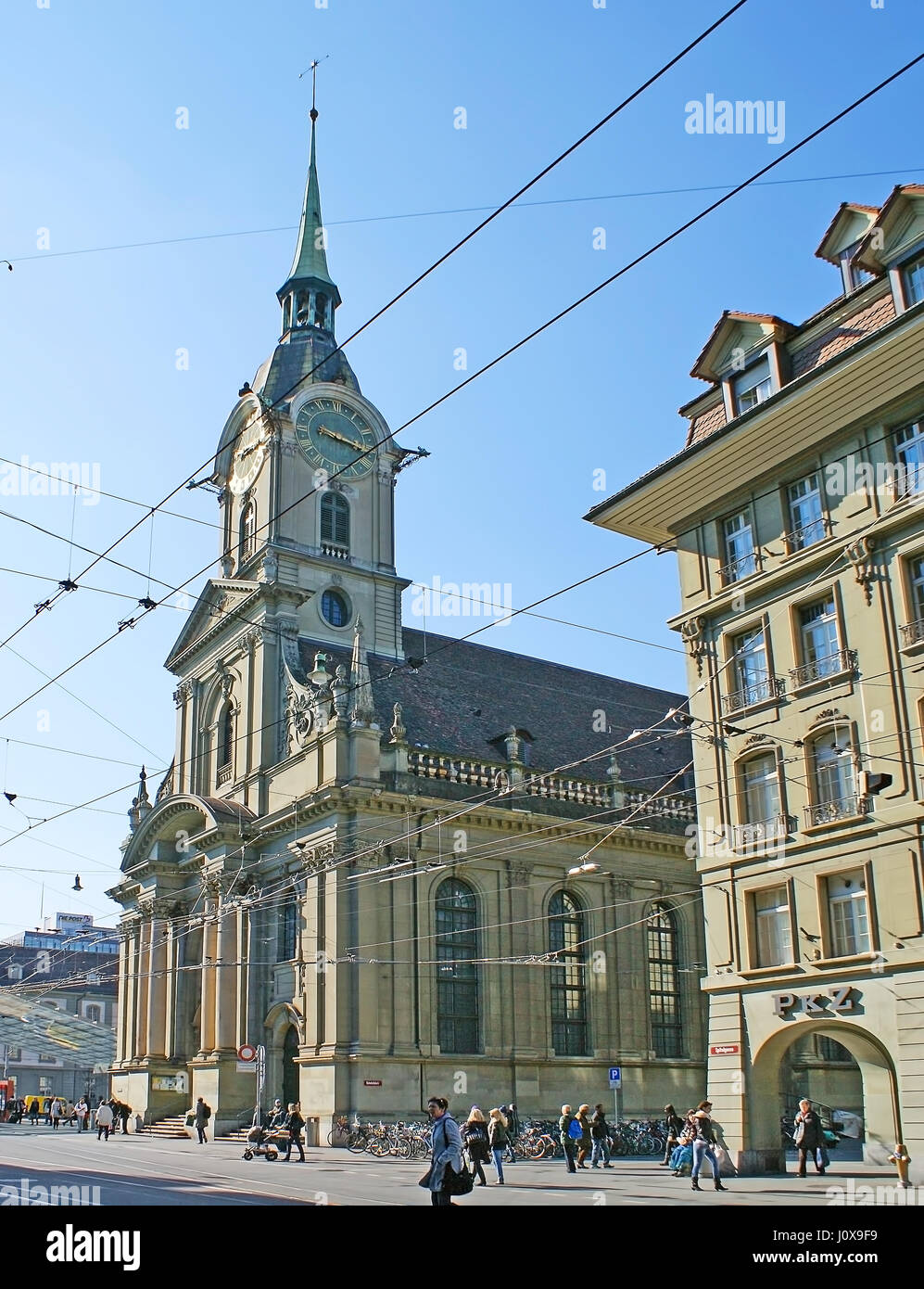 BERN, SWITZERLAND - MARCH 3, 2011: The tall belfry of the Church of the ...