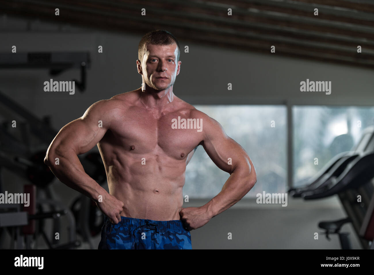 Portrait Of A Physically Fit Man Showing His Well Trained Body ...