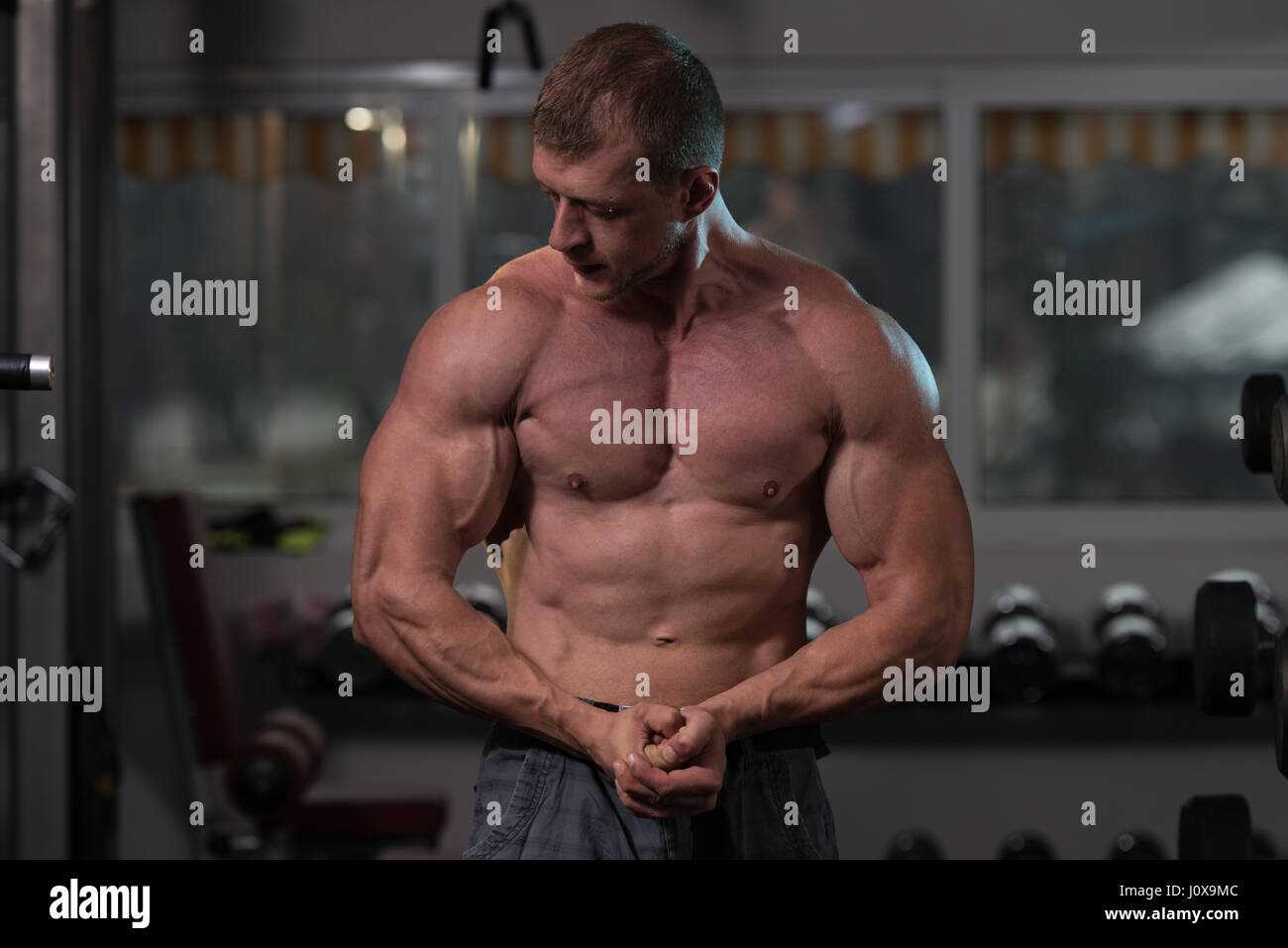 Portrait Of A Physically Fit Man Showing His Well Trained Body ...