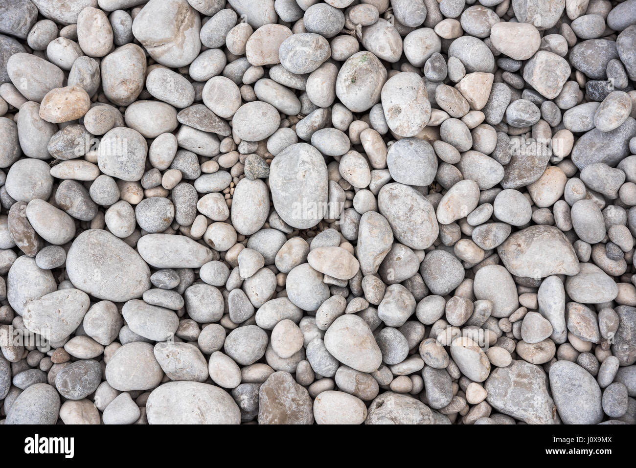 Background ot texture made of gray pebbles Stock Photo - Alamy