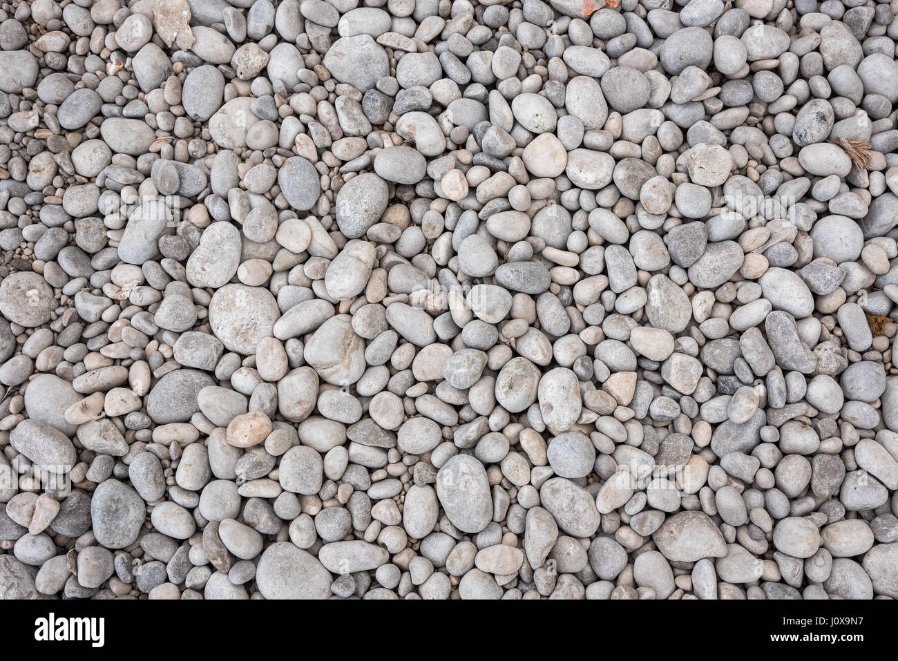 Background ot texture made of gray pebbles Stock Photo - Alamy