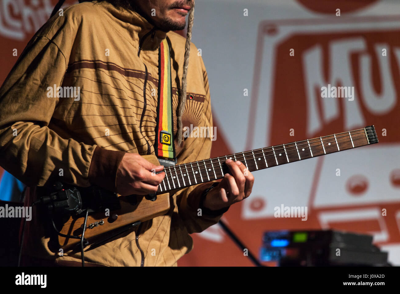 rock musician playing the bass in a live concert Stock Photo - Alamy