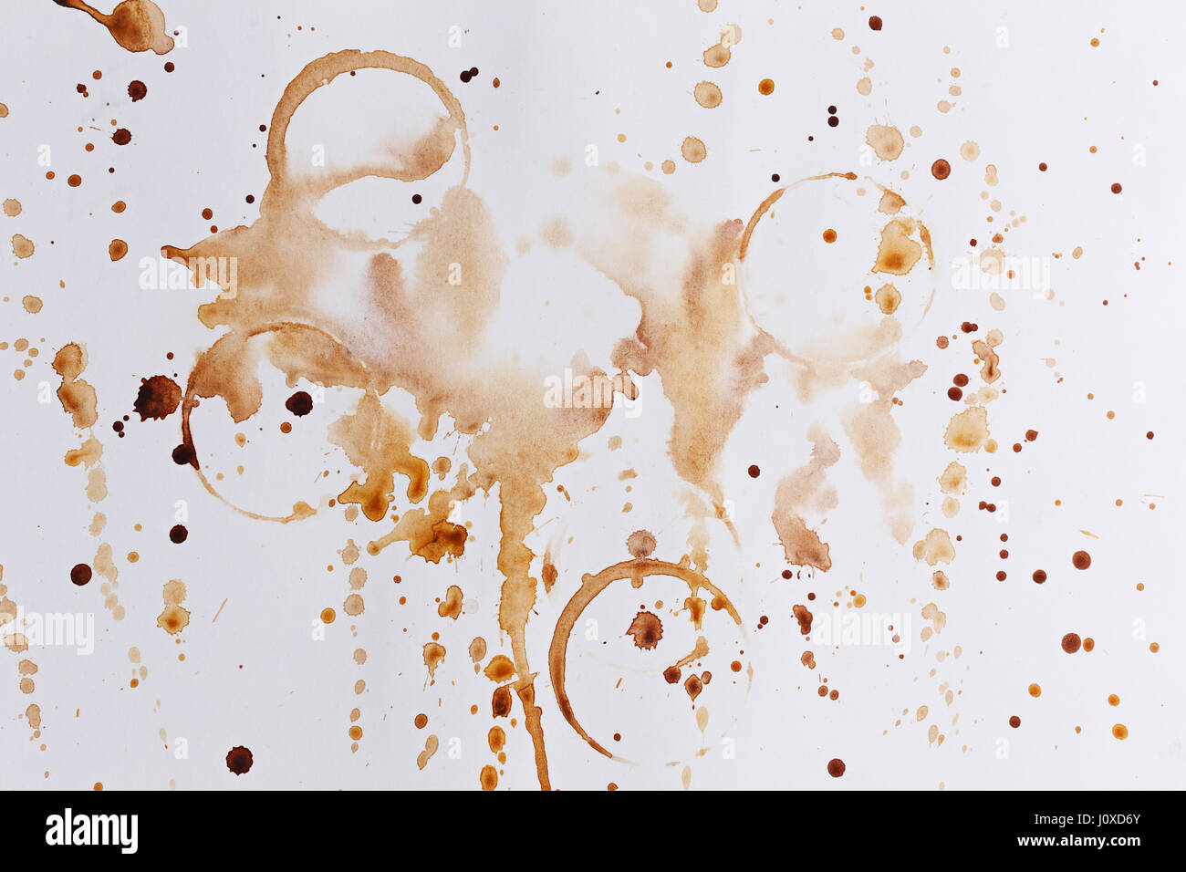 Prints of coffee mugs on white paper. Coffee splashes. Favourite drink ...