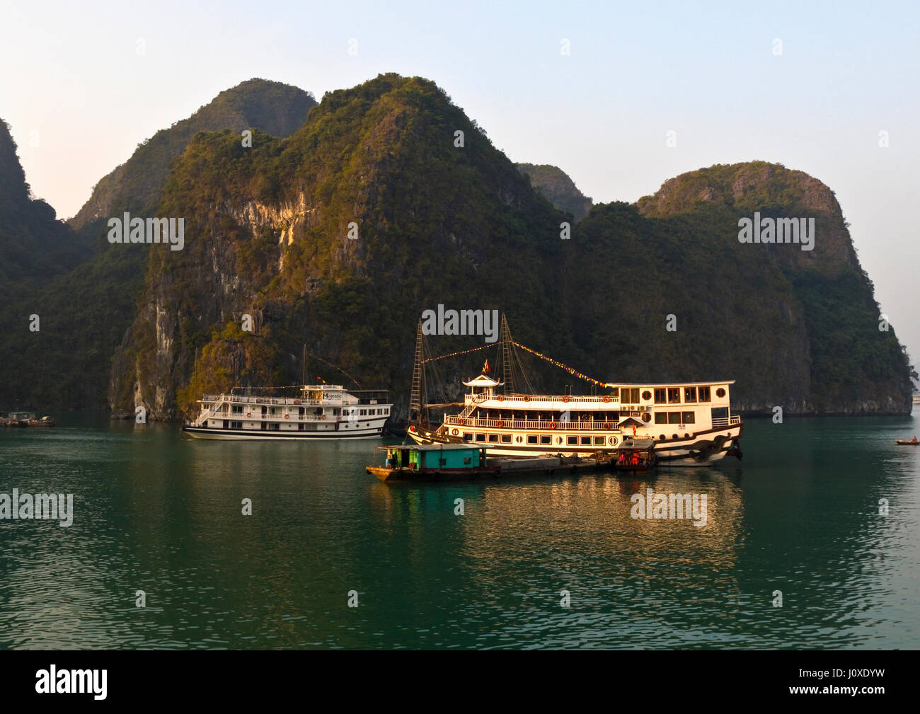 Barge collects waste from junk Stock Photo - Alamy