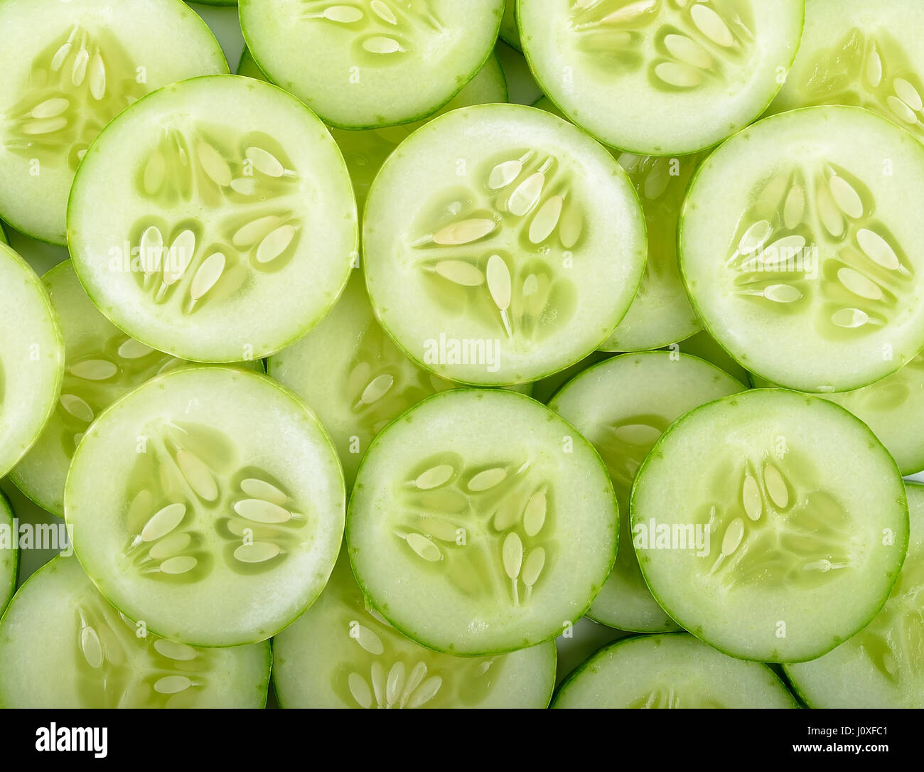 Close up cucumber slice background texture Stock Photo - Alamy
