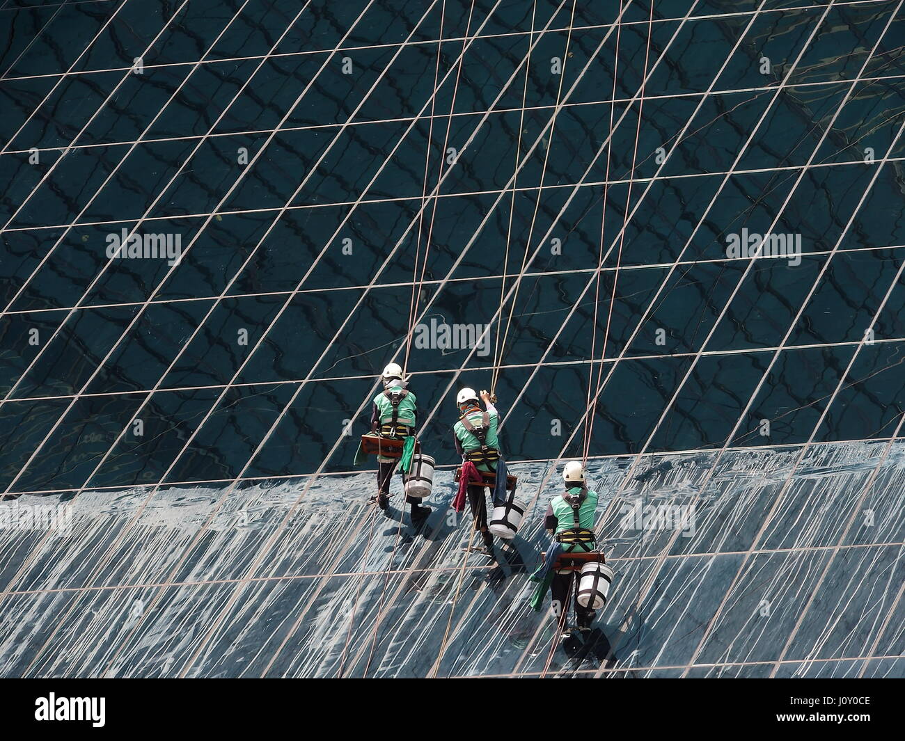 Men cleaning glass building Stock Photo - Alamy