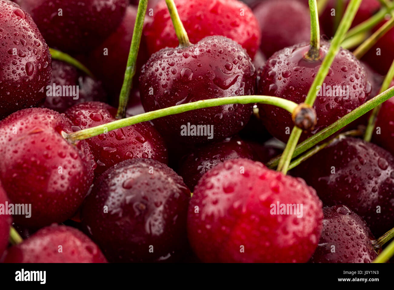 juicy red cherry background Stock Photo - Alamy