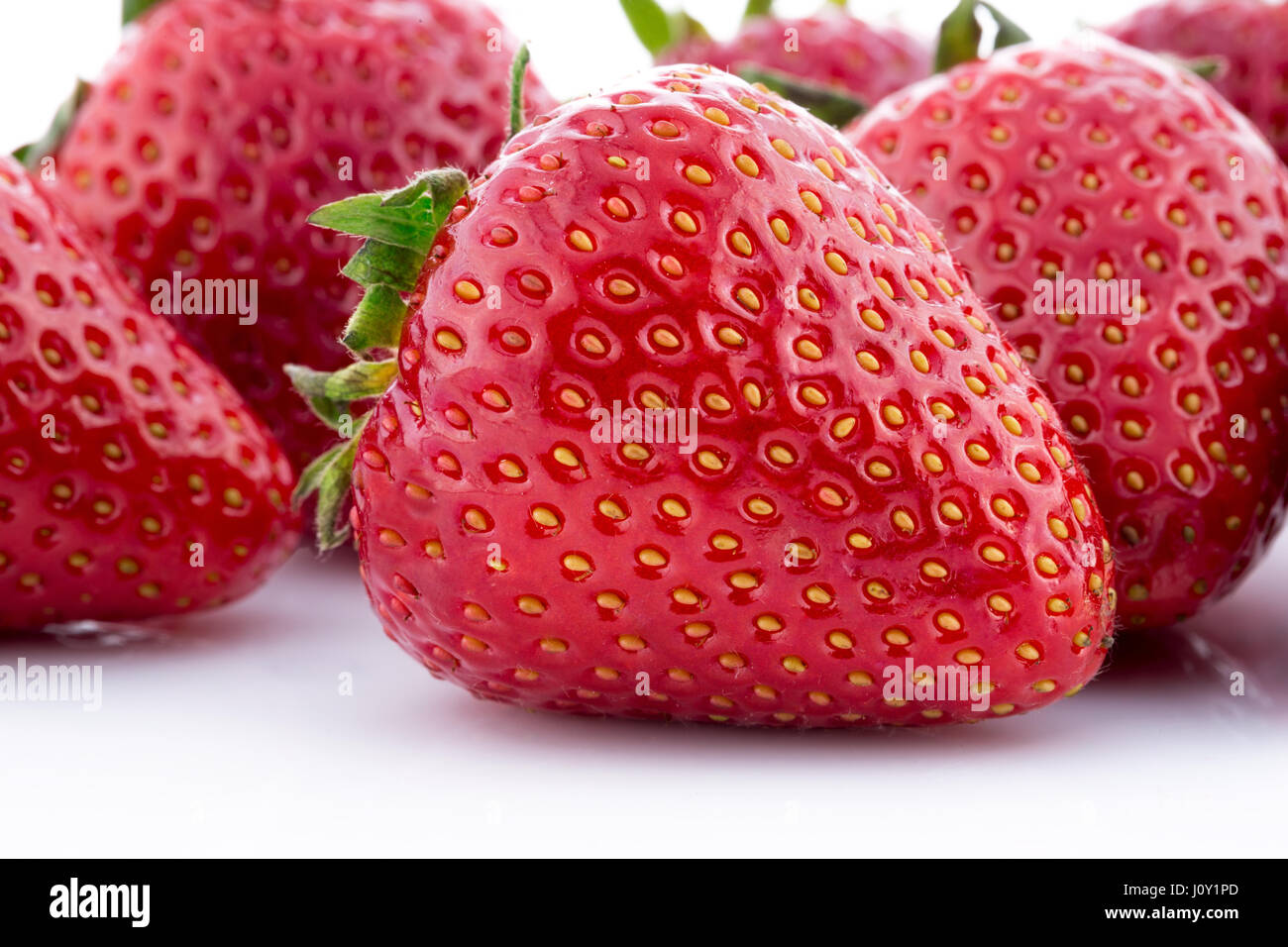 red strawberry close up isolated on a white Stock Photo - Alamy