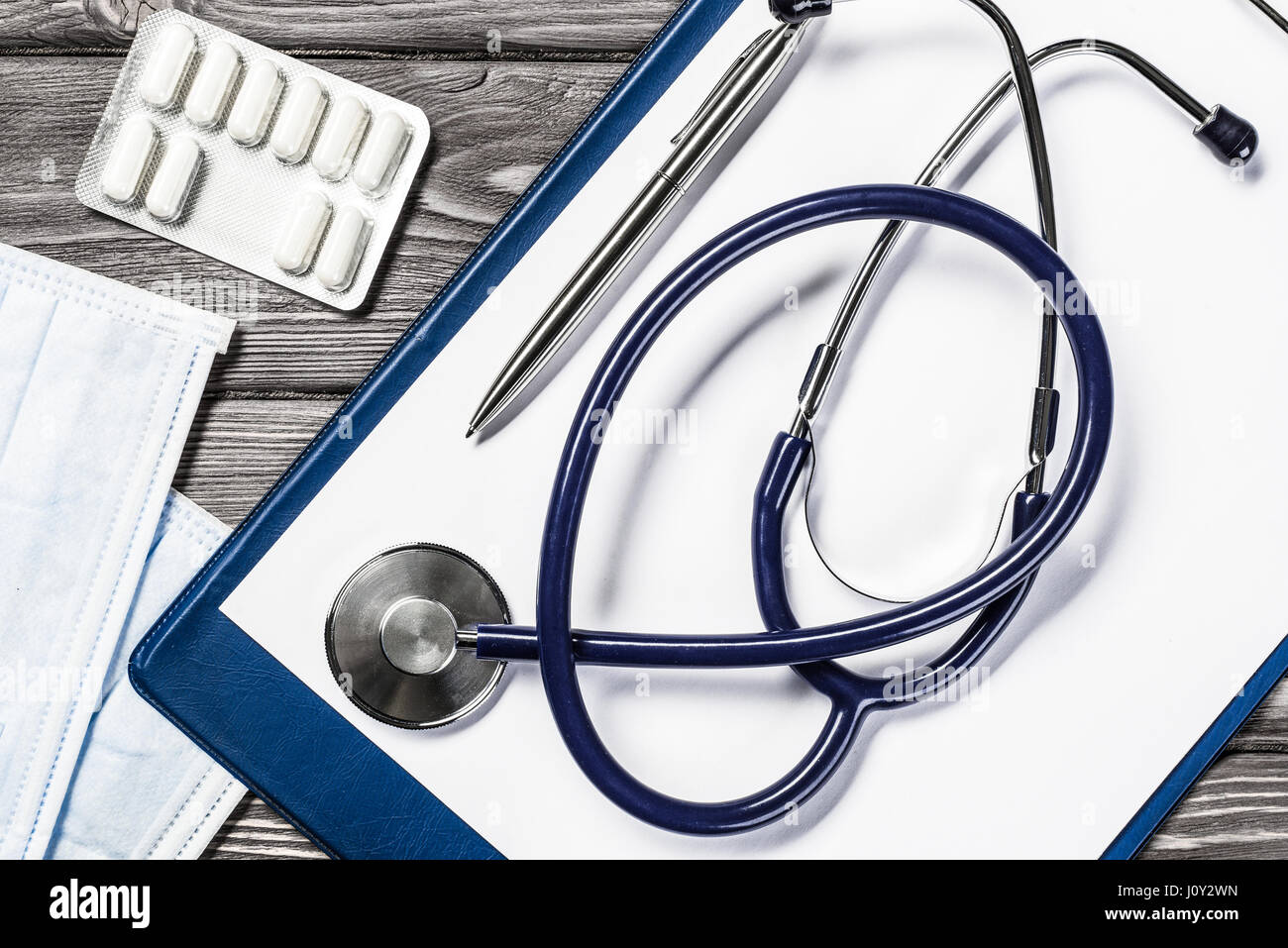 Desk of doctor with medicine things Stock Photo - Alamy