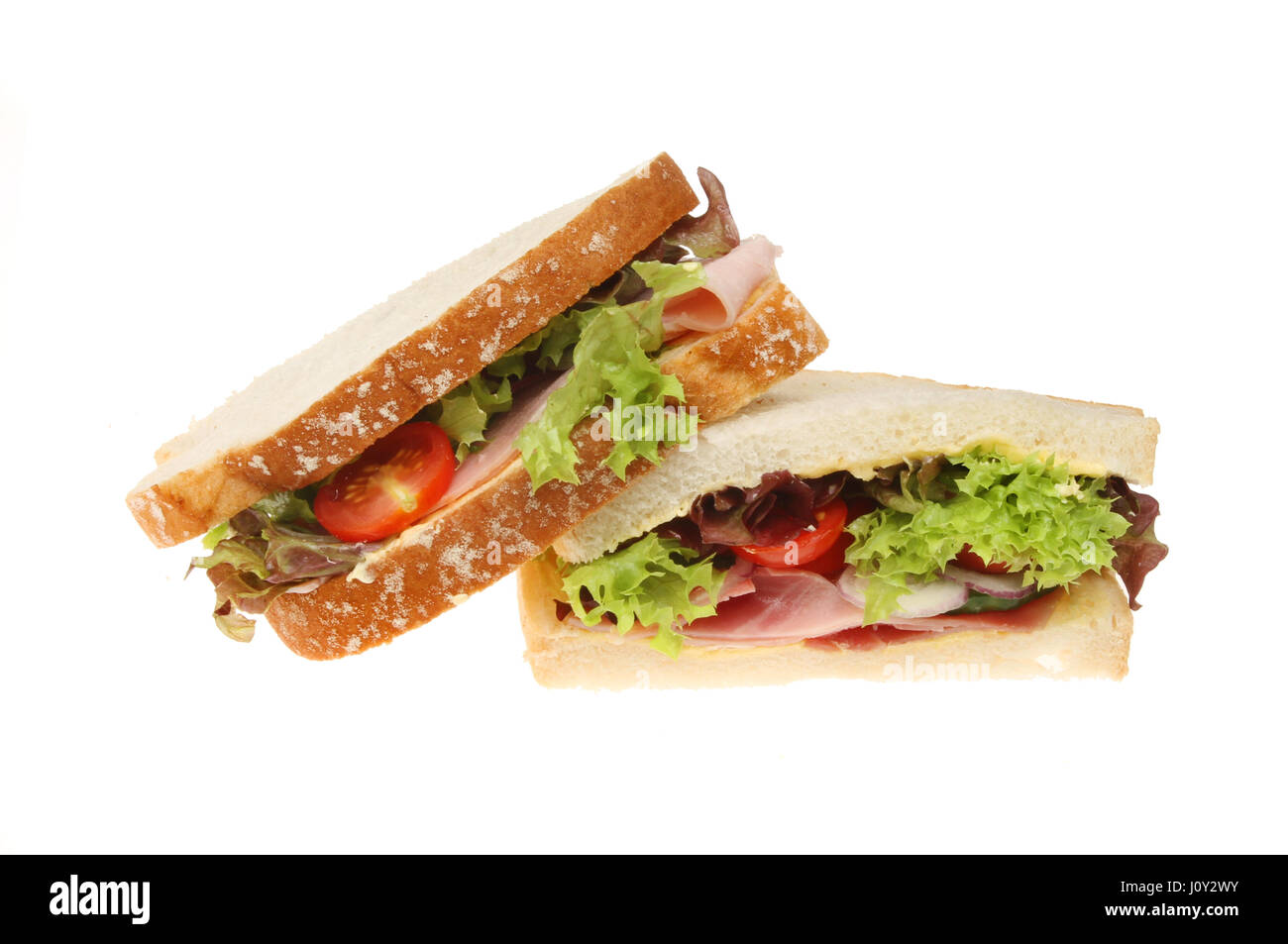White bread ham salad sandwich isolated against white Stock Photo - Alamy