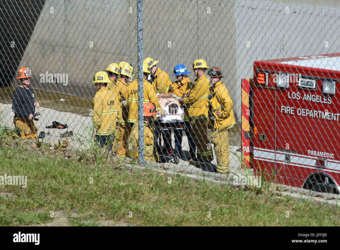 LAPD firefighters try to rescue a man threatening to jump from the ...