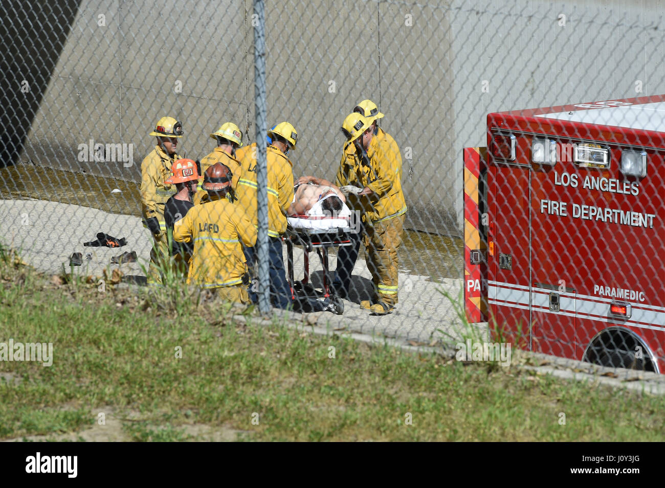 LAPD firefighters try to rescue a man threatening to jump from the ...