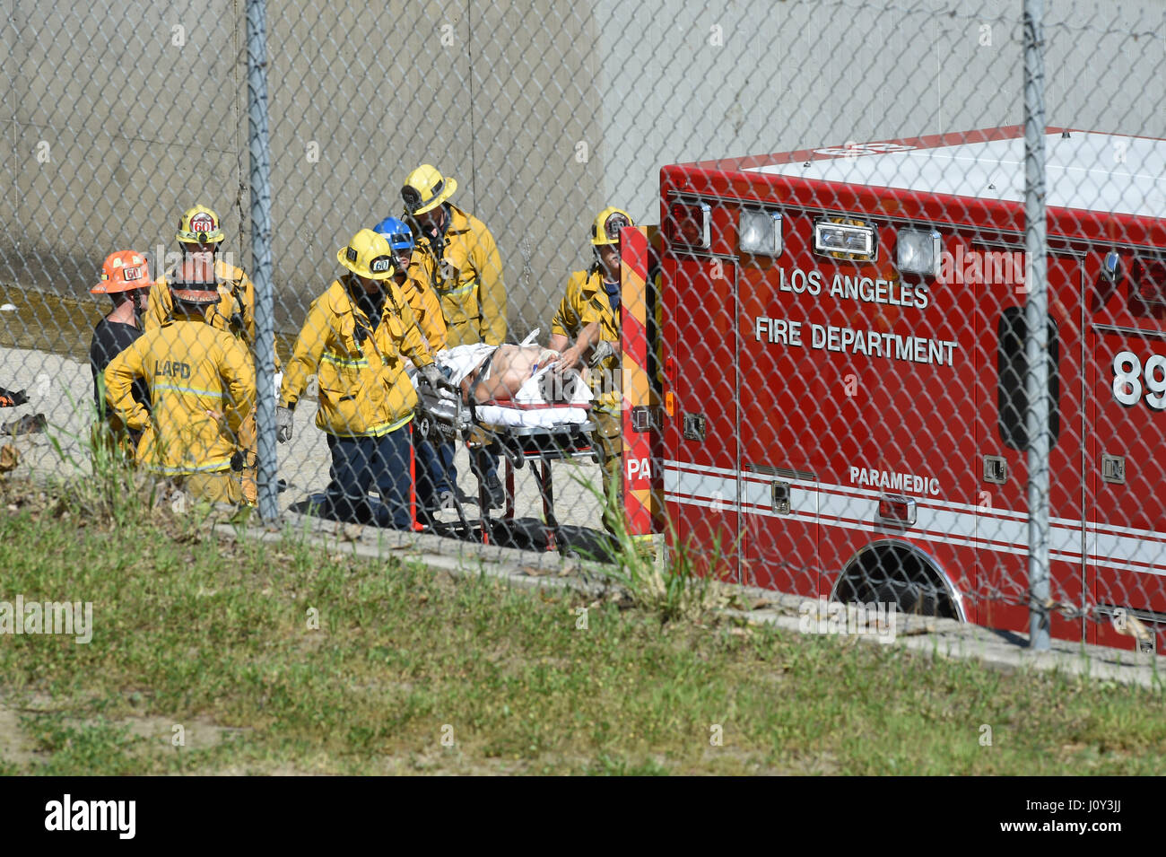 LAPD firefighters try to rescue a man threatening to jump from the ...