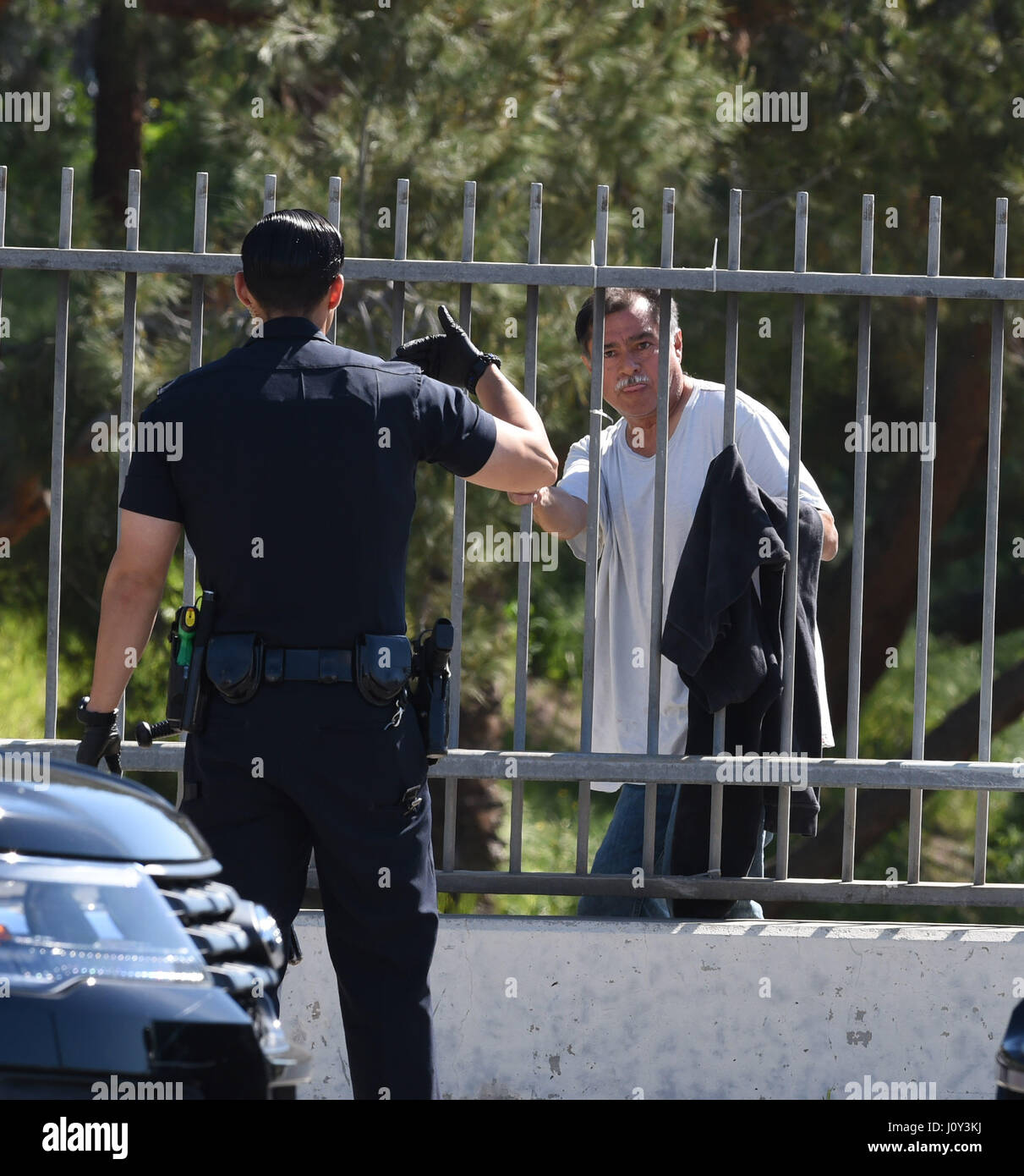 LAPD firefighters try to rescue a man threatening to jump from the ...