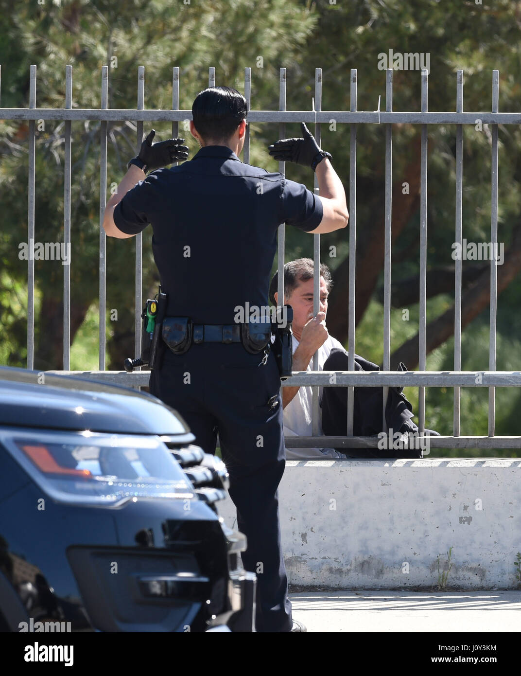 LAPD firefighters try to rescue a man threatening to jump from the ...