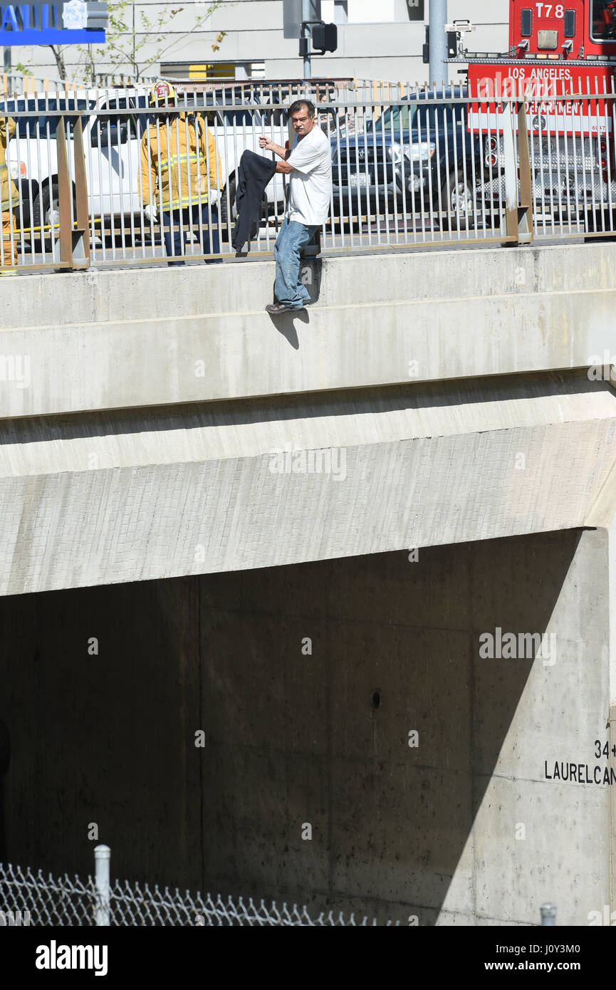 LAPD firefighters try to rescue a man threatening to jump from the ...