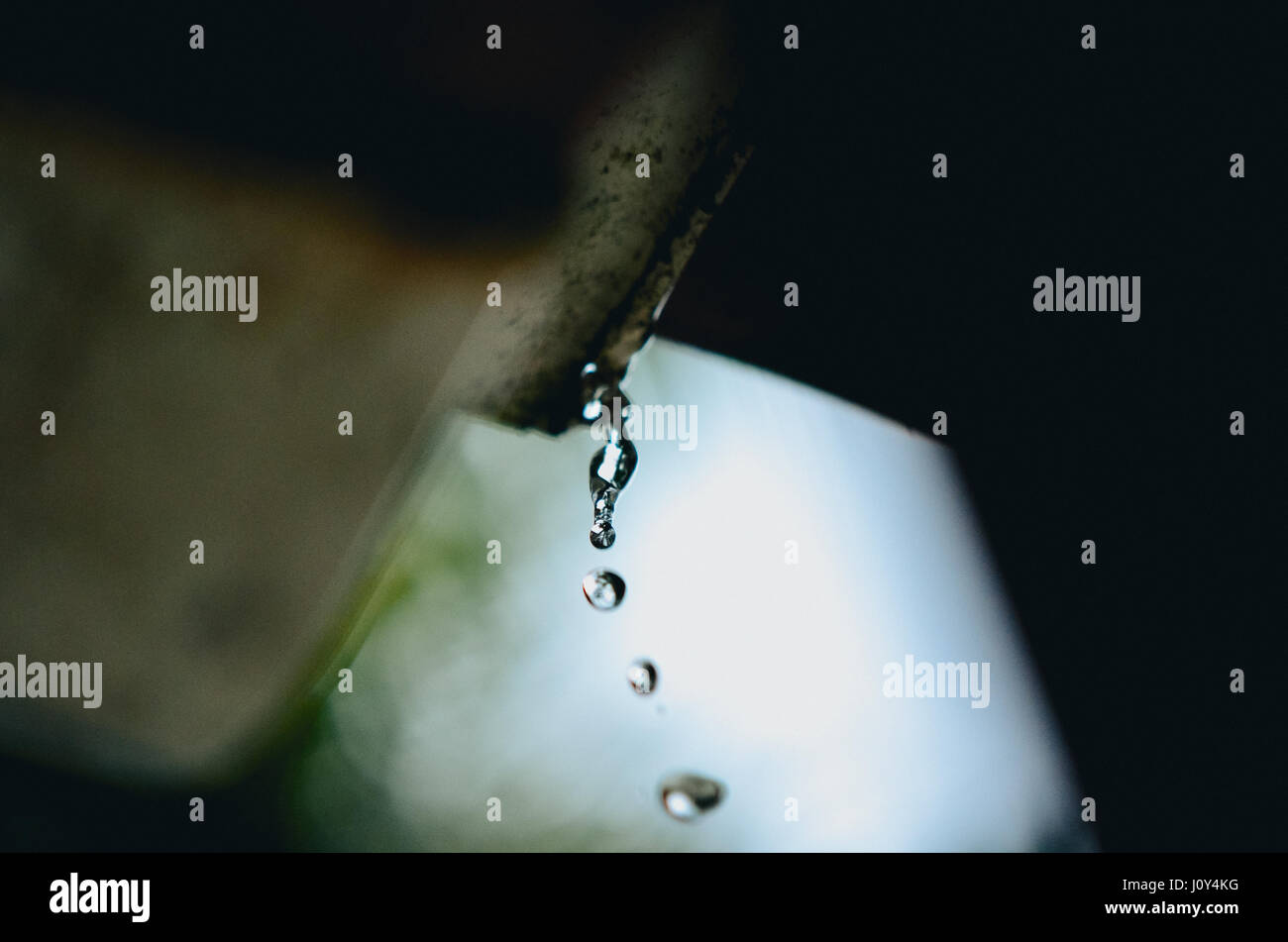 Water coming down from a gutter Stock Photo - Alamy