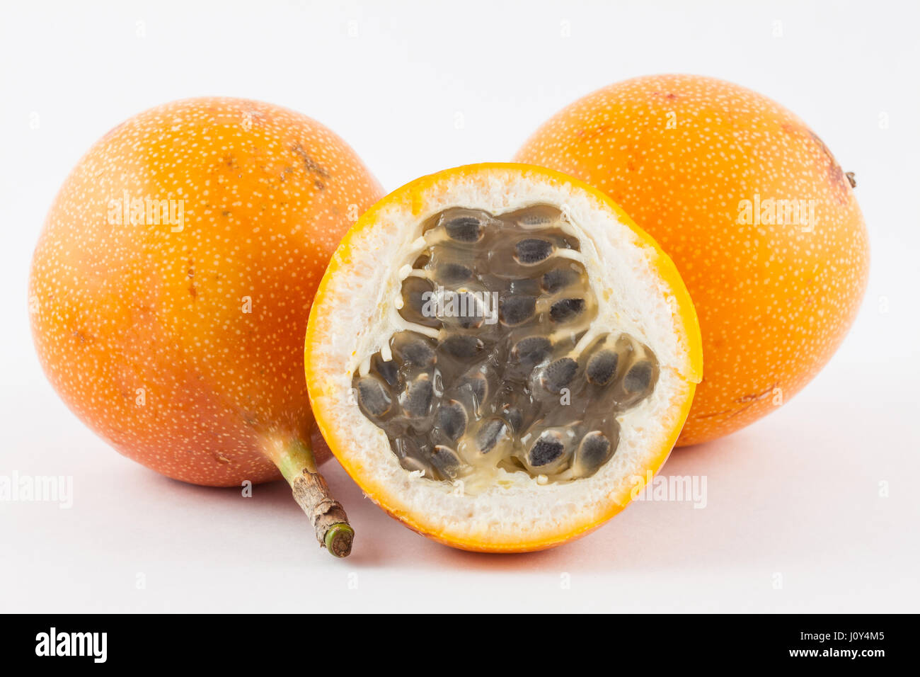 Sweet granadilla (Passiflora ligularis) isolated in white background ...