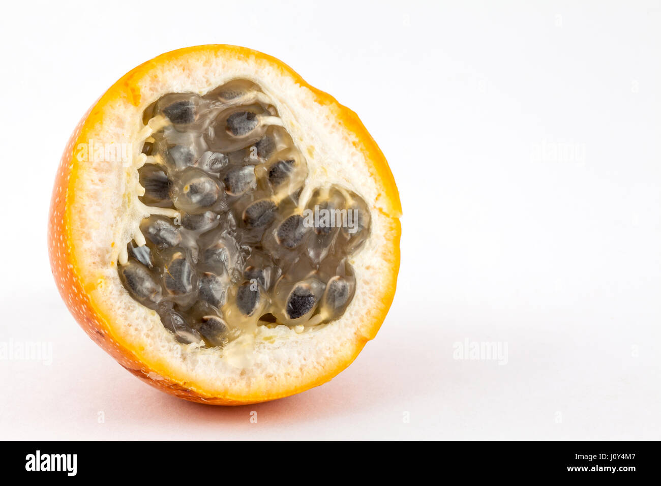 Sweet granadilla (Passiflora ligularis) isolated in white background ...