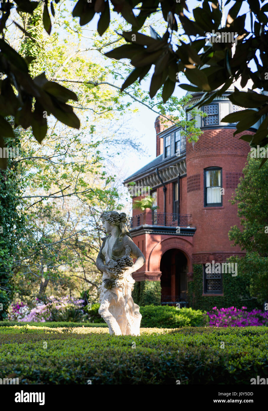 A statue in the front yard of a home in the Historic District of ...