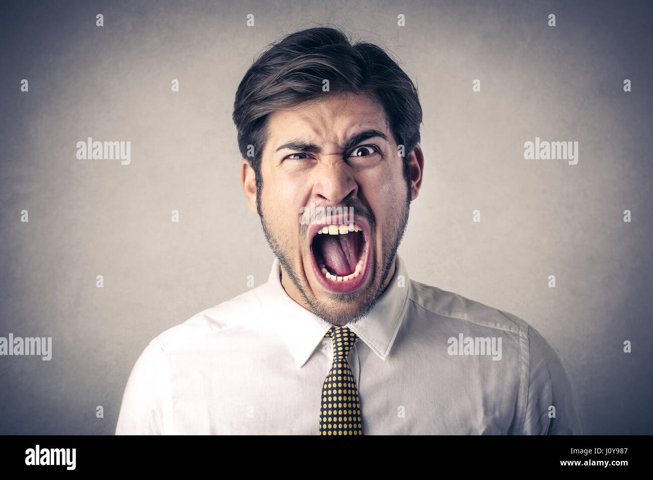 Portrait of yelling businessman Stock Photo - Alamy