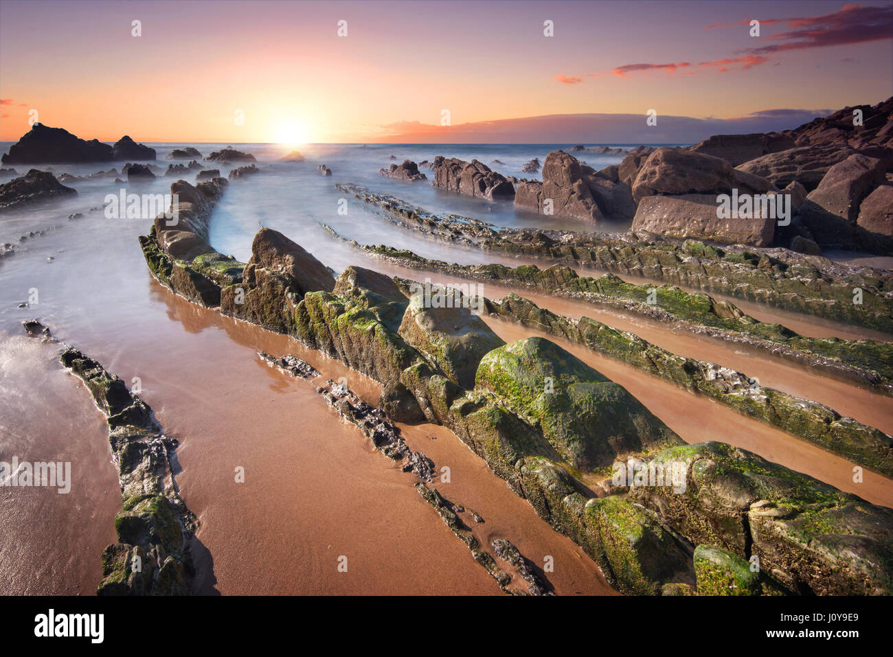 Scenic Sunset at barrika beach, mossy rocks. Bilbao, Basque country ...