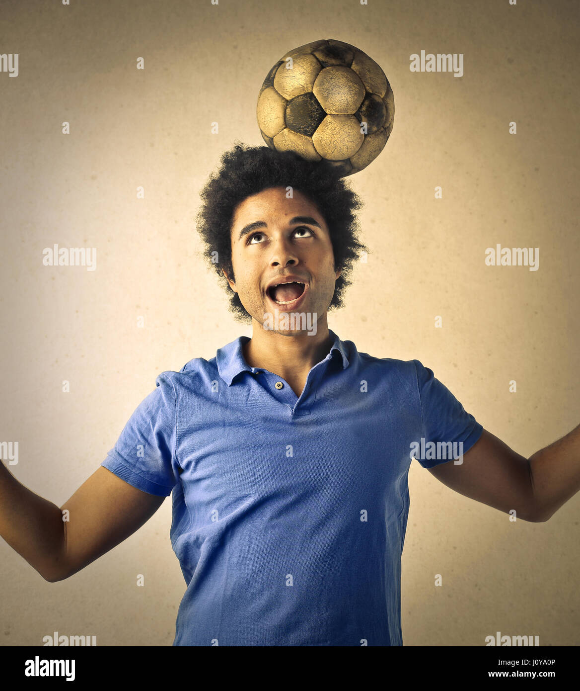 Man playing with soccer ball Stock Photo - Alamy