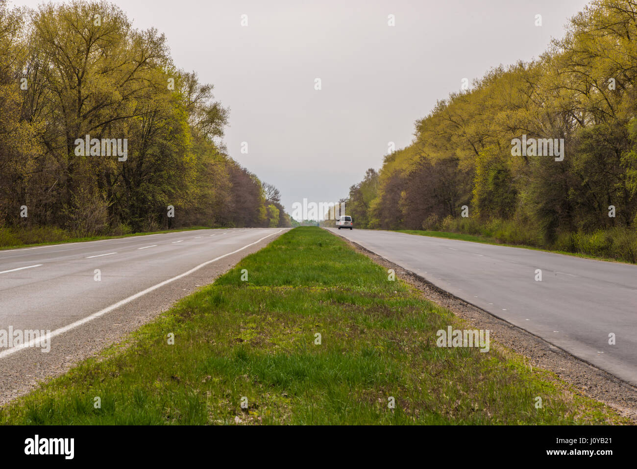 Cars drive along sunset road hi-res stock photography and images - Alamy