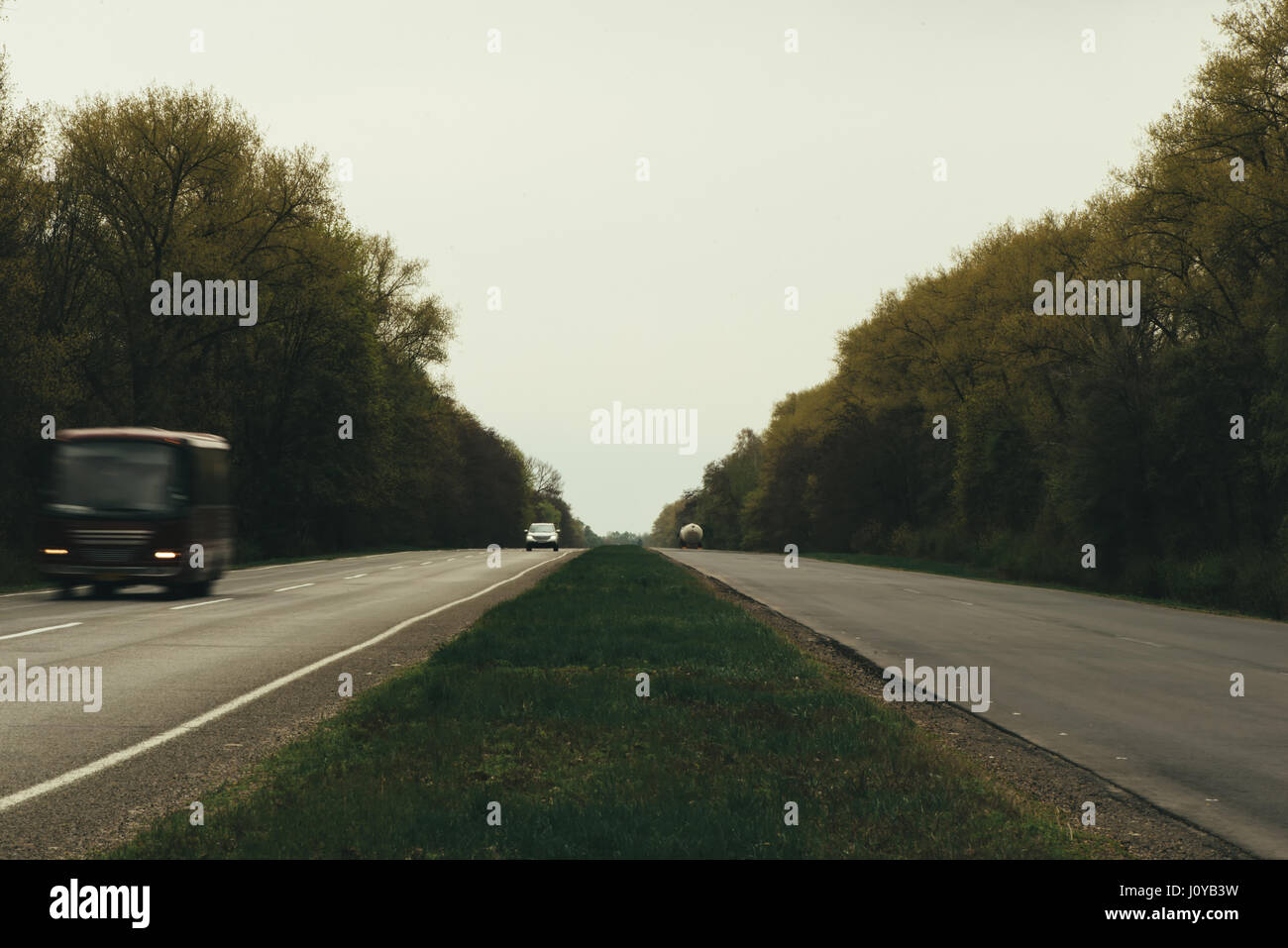 Cars drive along country road hi-res stock photography and images - Alamy