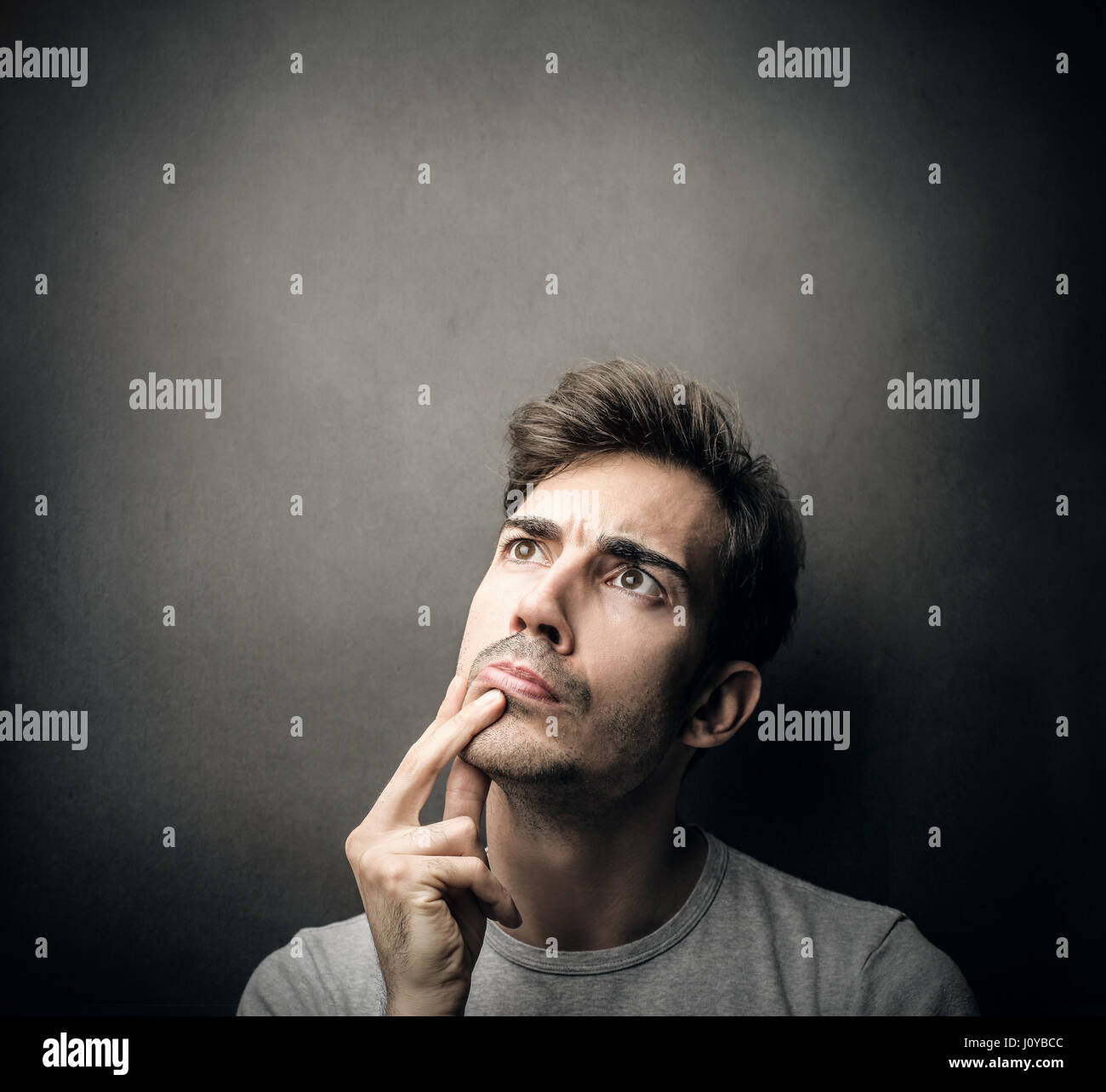 Portrait of thinking man Stock Photo - Alamy