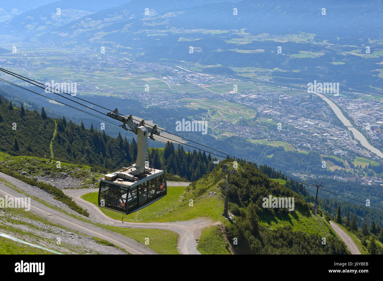 A cable car moving away from the Innsbrucker Nordkettenbahnen Station ...
