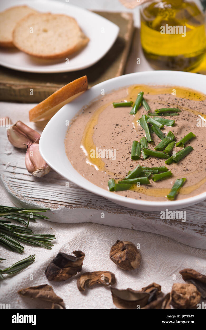Mushroom soup puree in a ceramic bowl and olive oil Stock Photo - Alamy