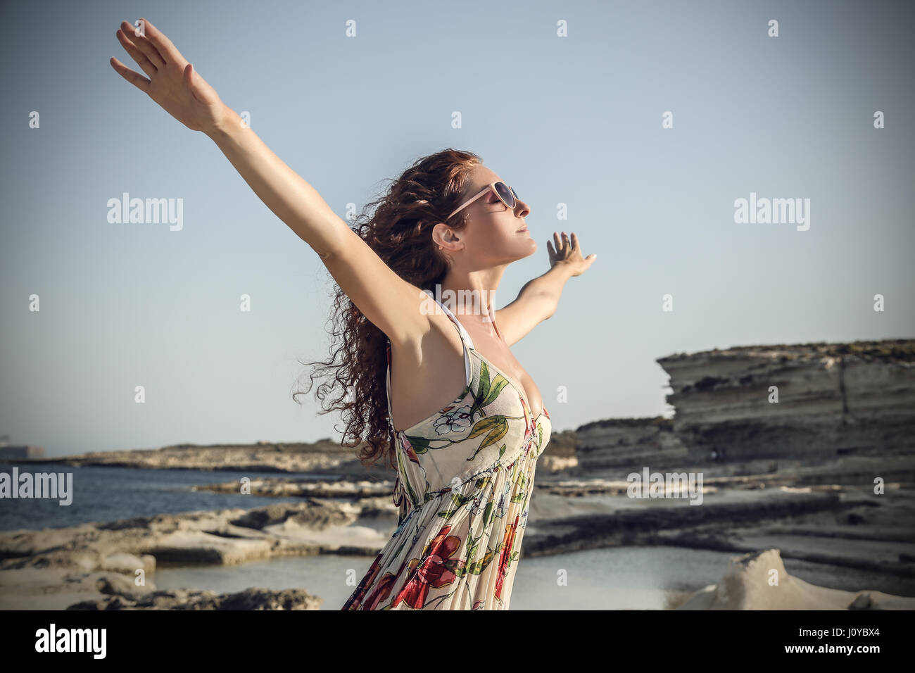 Woman feeling free outside Stock Photo - Alamy