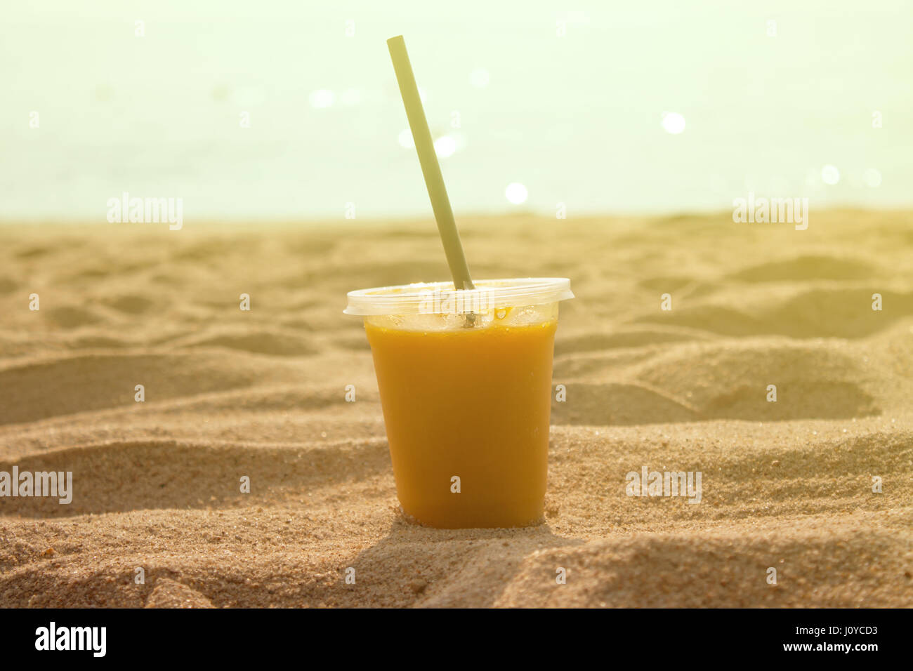 smoothies of tropical fruits on the sand sea beach (toning Stock Photo ...